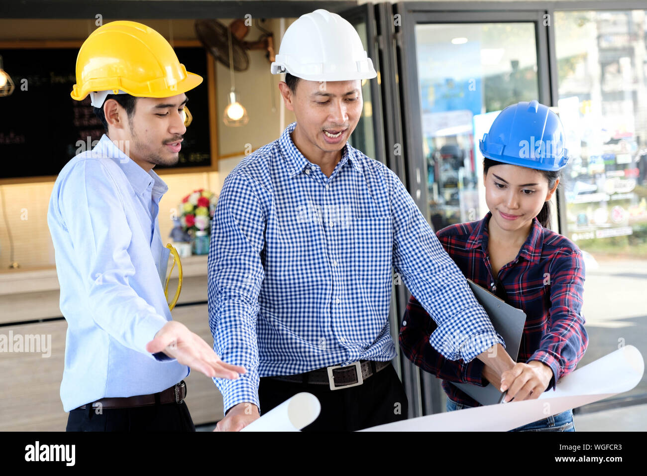 Business People Looking At Paper While Working In Office Stock Photo ...