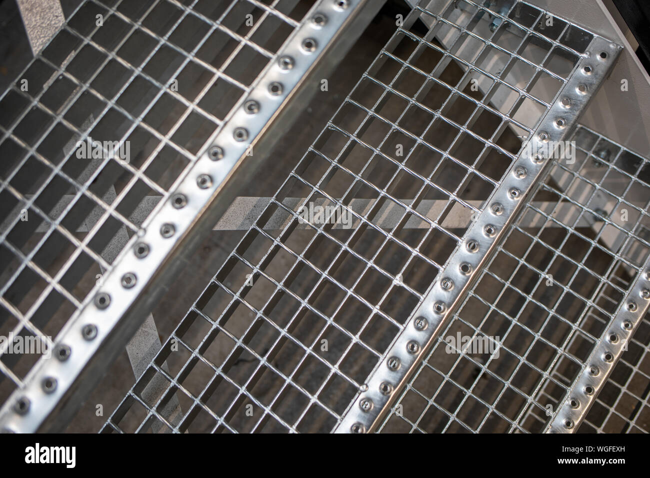 A metal floor and stairs are located in a factory hall Stock Photo - Alamy
