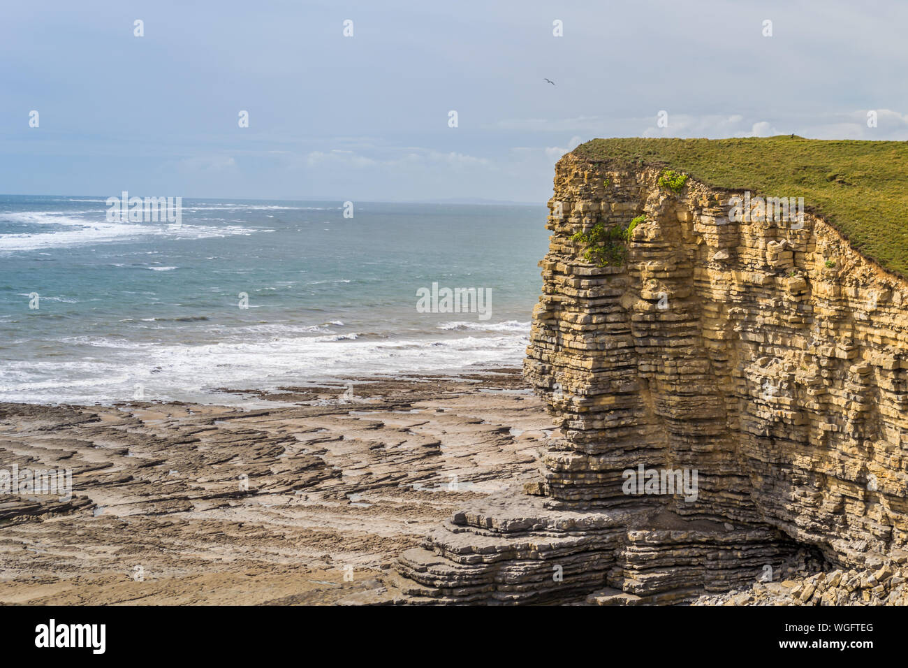 Coast with beach and monuments, Wales Stock Photo - Alamy