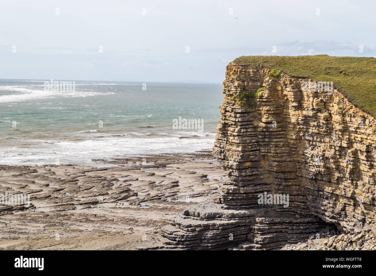Coast with beach and monuments, Wales Stock Photo - Alamy