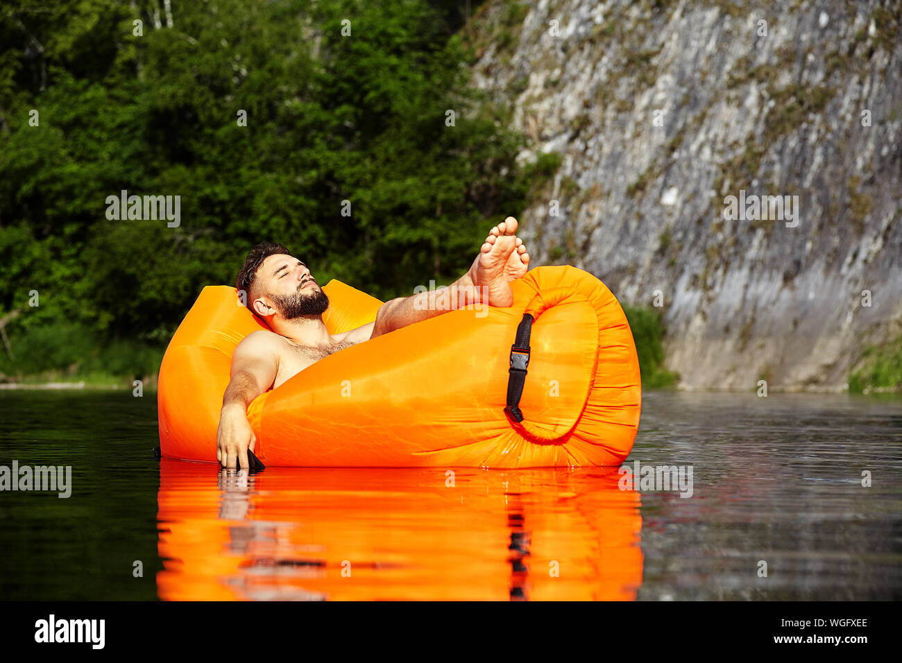 The businessman fell asleep in a raft drifting along the river and ...