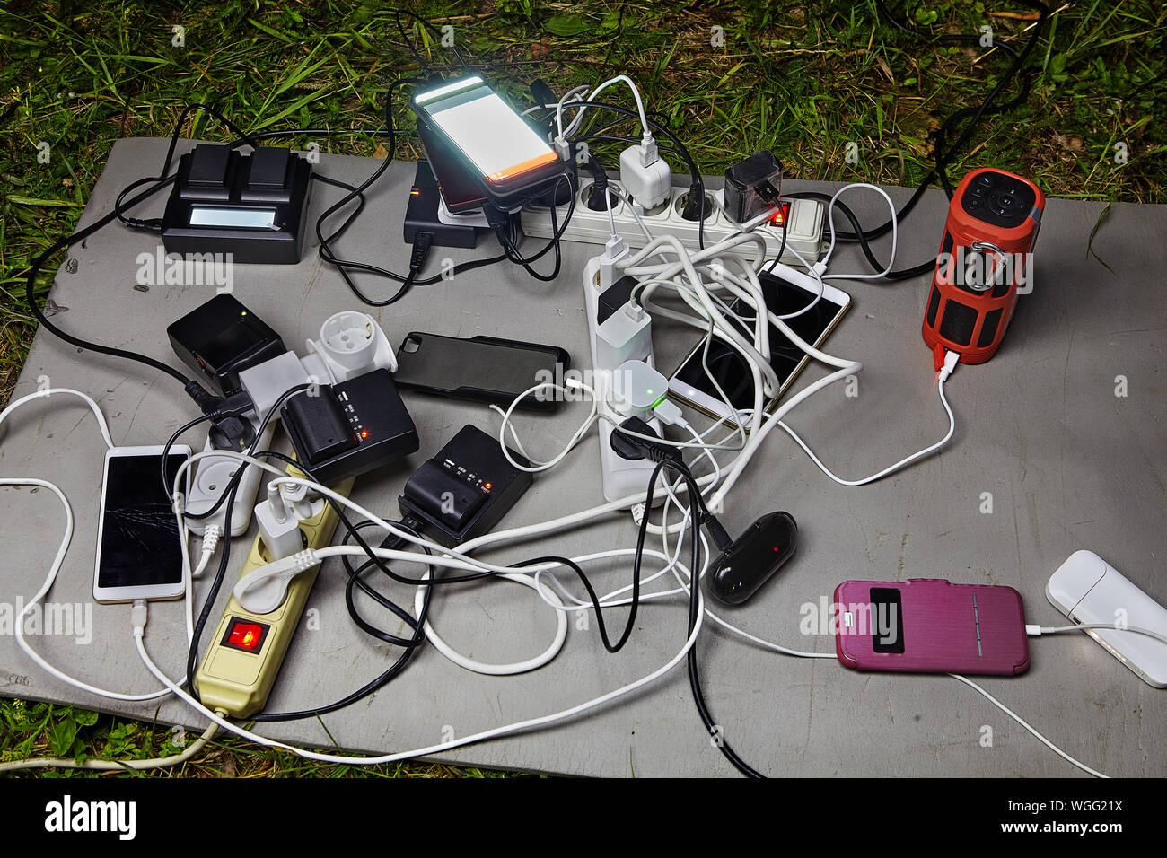 The batteries of mobile electronic devices are charged in chargers ...