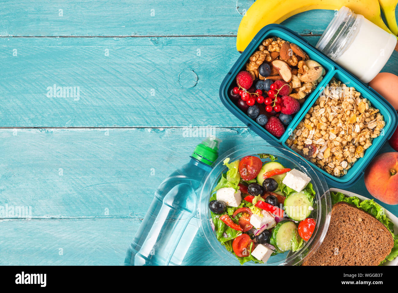 set of lunch boxes with food ready to go for work or school. greek ...