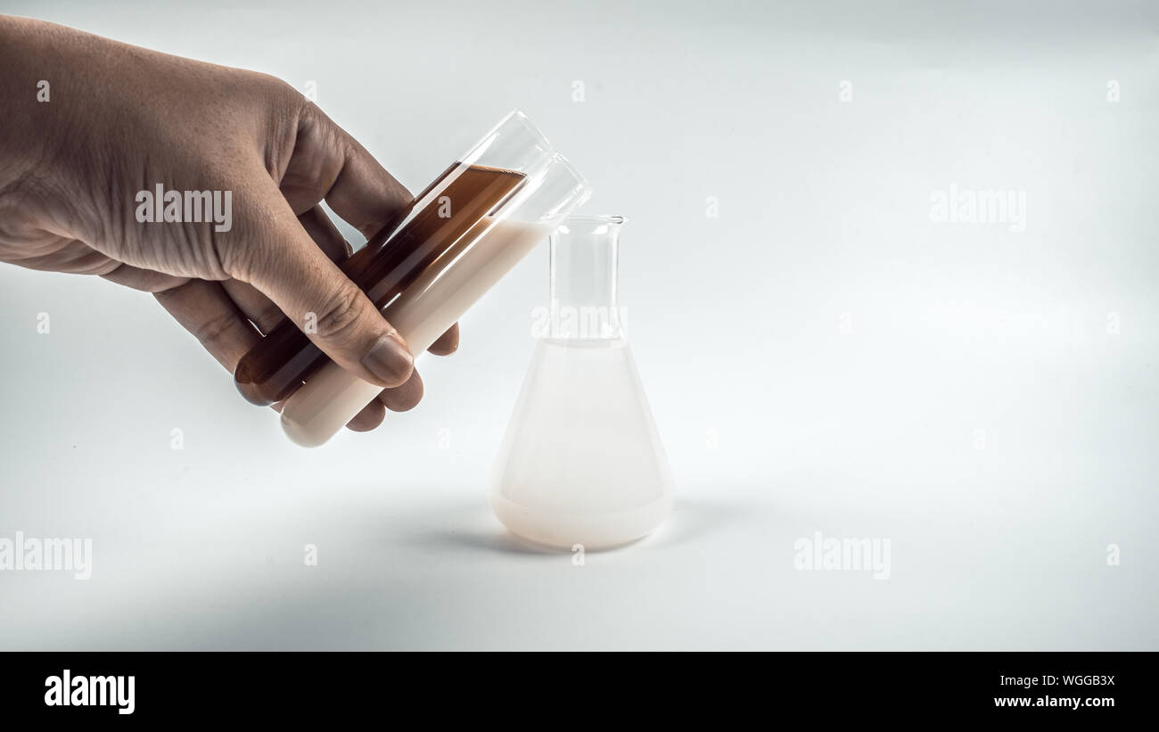 Man pouring chemicals hi-res stock photography and images - Alamy