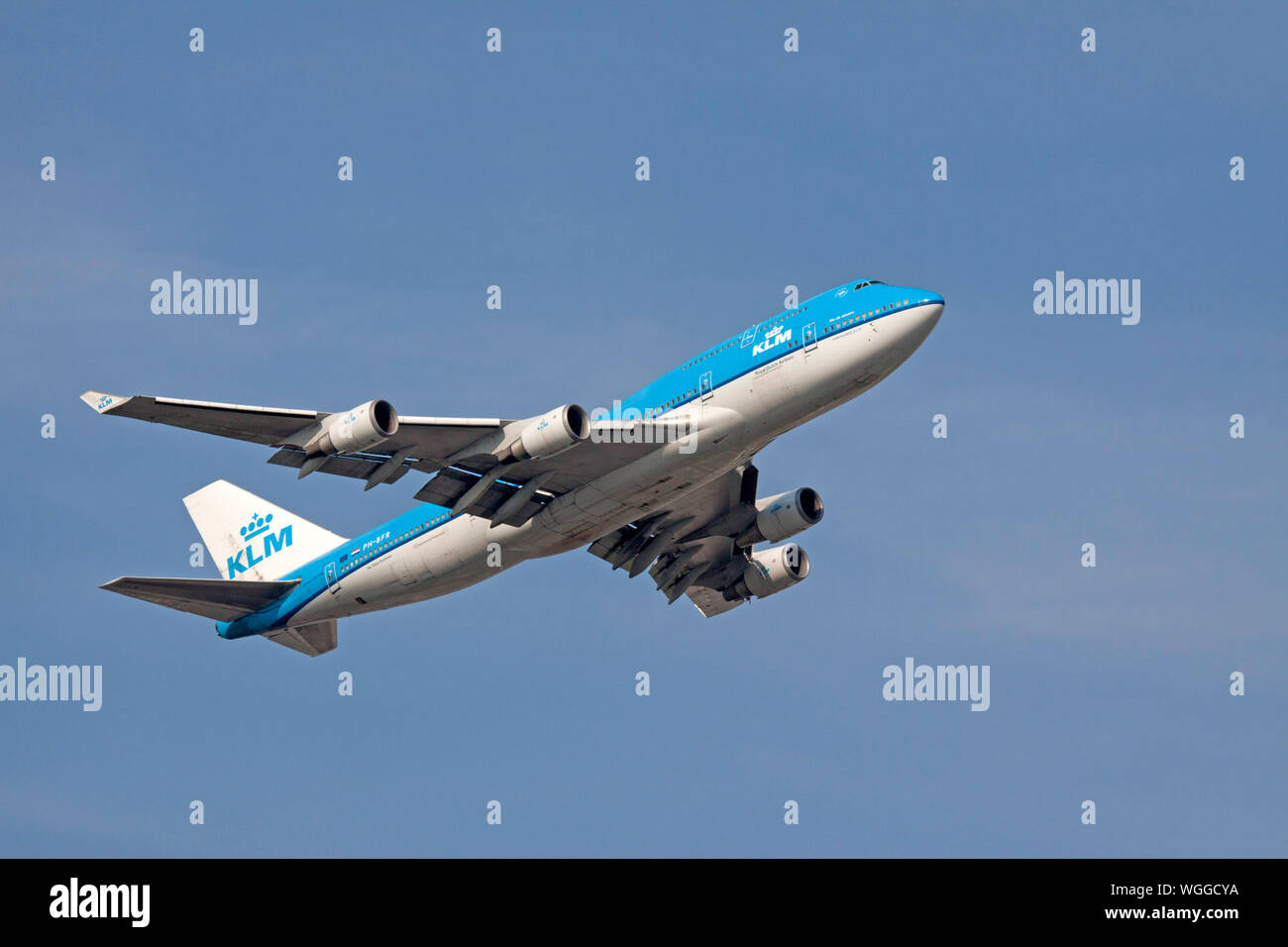 Blue Boeing 747 of the Klm just rising from the Schiphol Airport runway ...