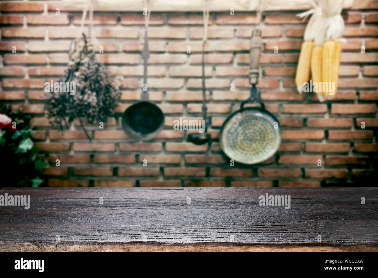 Table and brick wall hi-res stock photography and images - Alamy