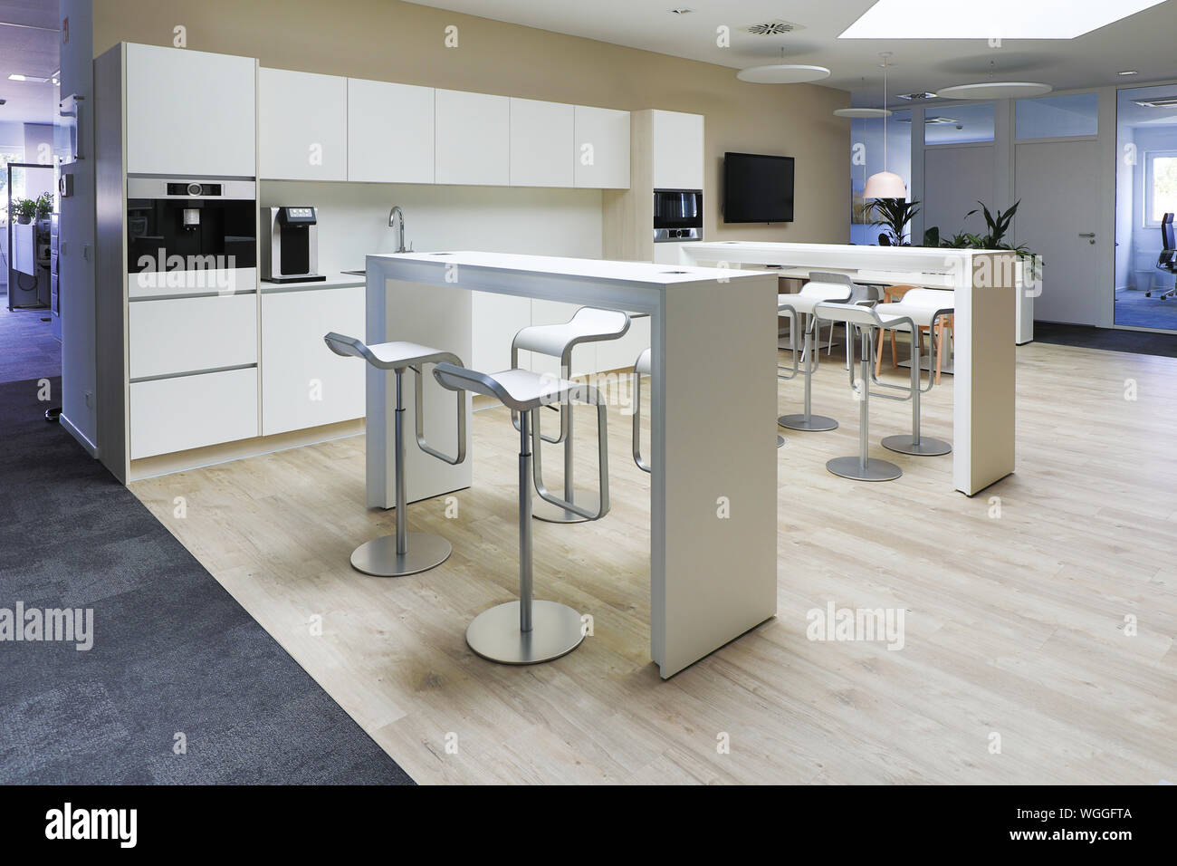 in a modern office floor there is a beautiful office kitchen for the ...