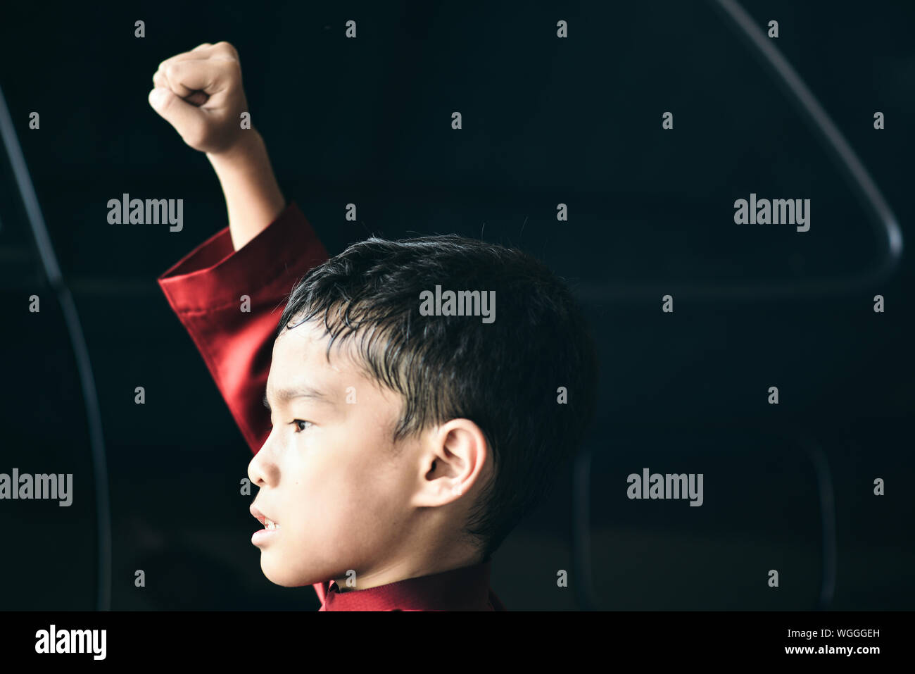 Boy with raised hand hi-res stock photography and images - Alamy