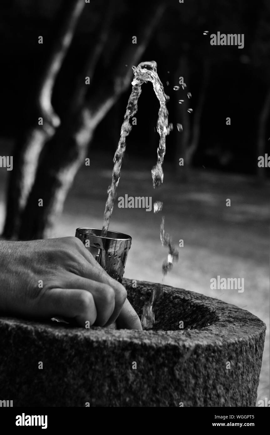People filling water hi-res stock photography and images - Alamy