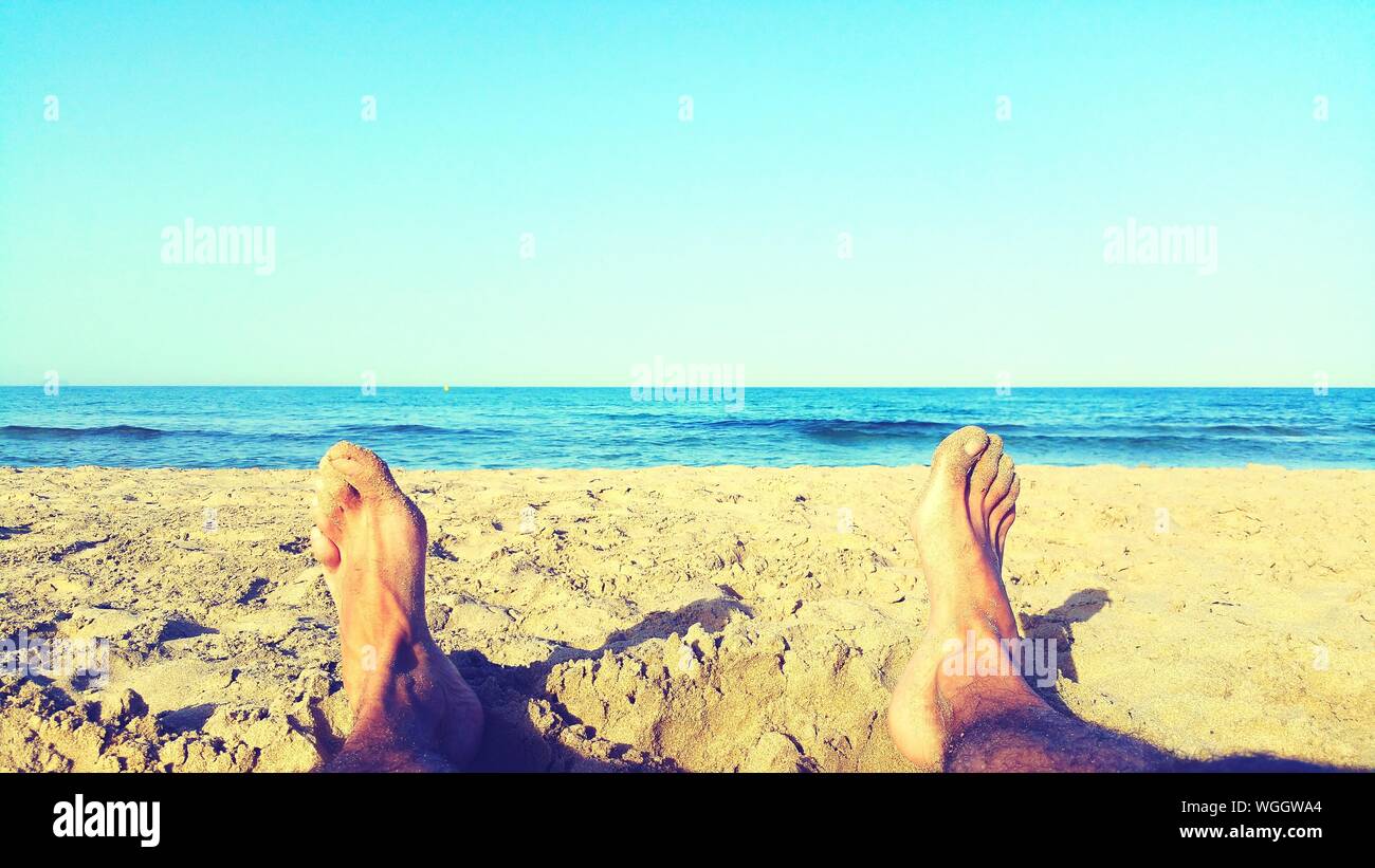 Men lying down sunbathing hi-res stock photography and images - Alamy