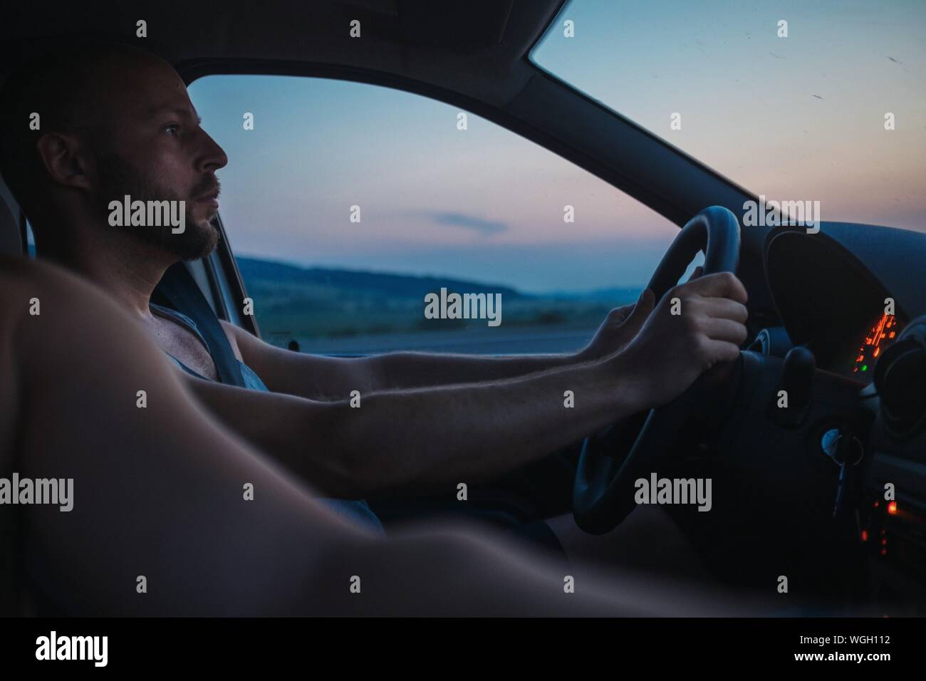 Man driving car sunset interior hi-res stock photography and images - Alamy