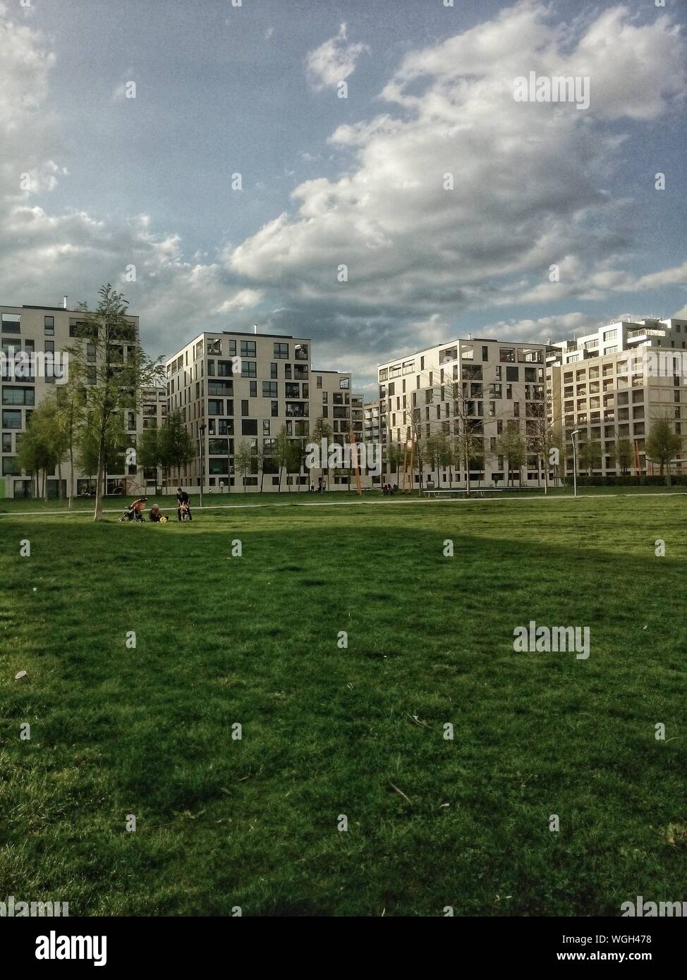Building By Grass Area Stock Photo - Alamy