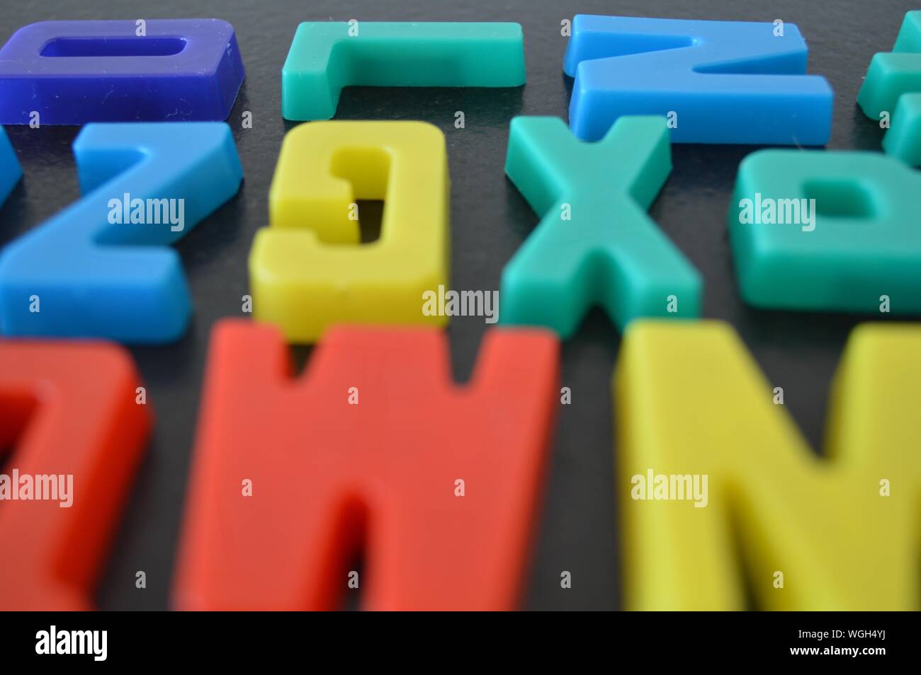 Colorful plastic alphabets hi-res stock photography and images - Alamy