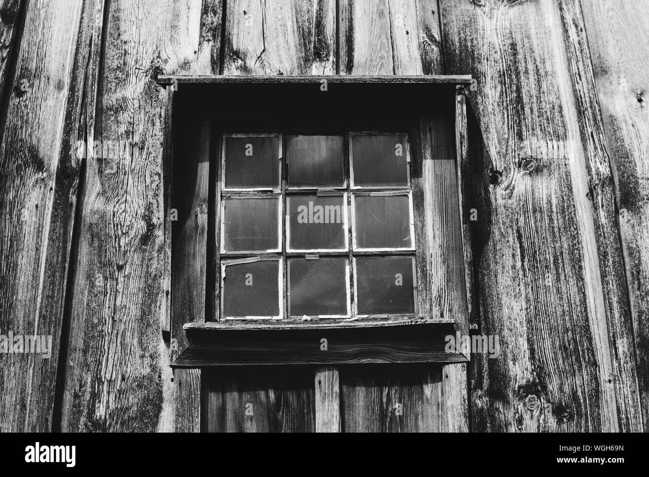 detail of old vintage window with square glasses over wooden wall Stock ...