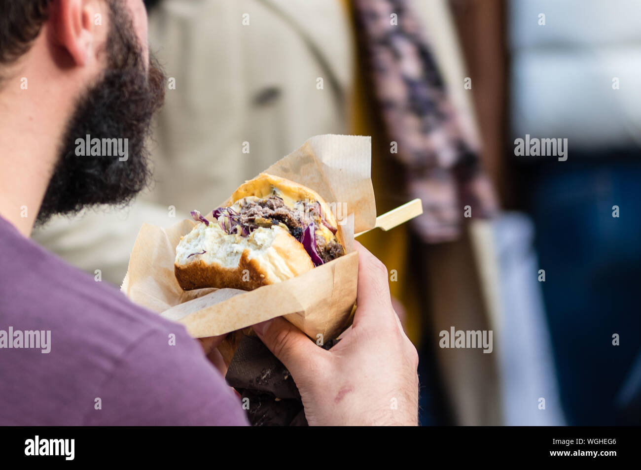 Man Holding Burger High Resolution Stock Photography and Images - Alamy