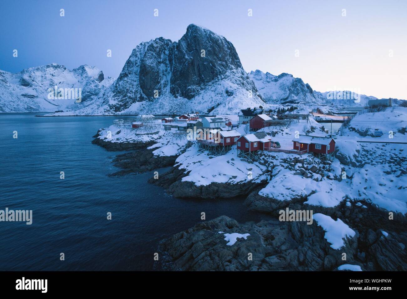 traditional norwegian wooden house rorbu to stand on the shore of the ...