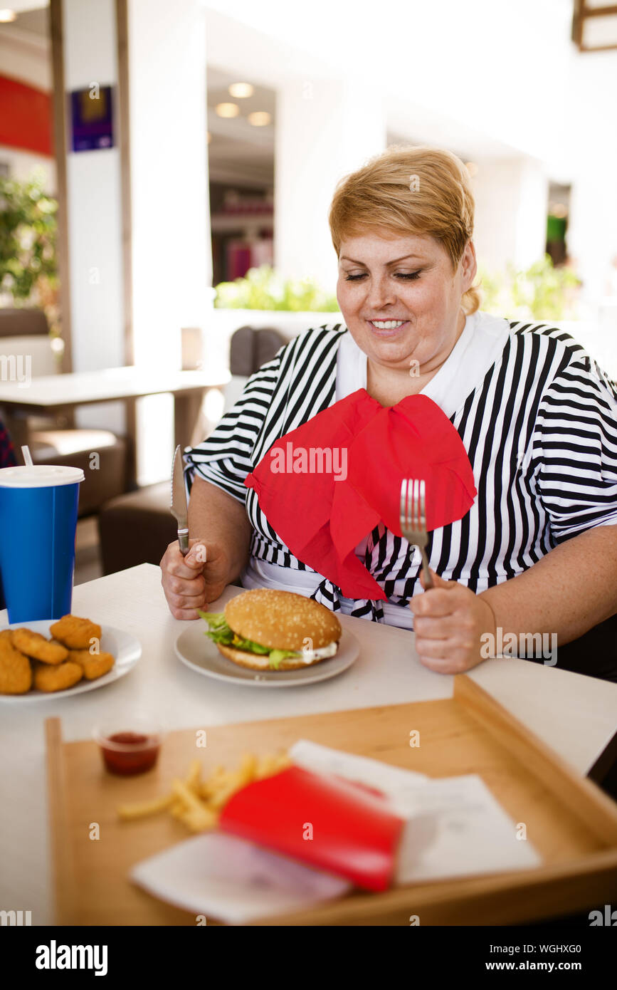 Overweight Woman Eating Fastfood Meal High Resolution Stock Photography ...