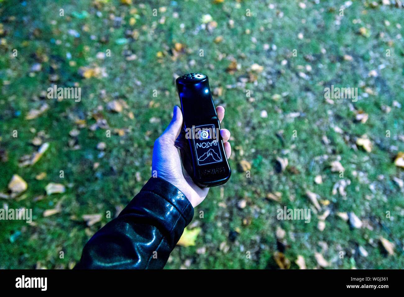 Hand holding a bat detector on a bat walk in the park, London, UK Stock ...