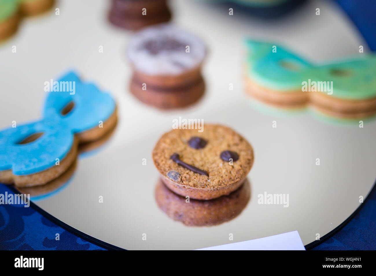 Round Chocolate Biscuit in the Shape of a Face with Smile Stock Photo ...