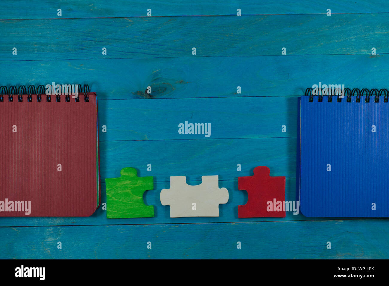 Problem solving and teamwork concept with colorful puzzle pieces in red ...