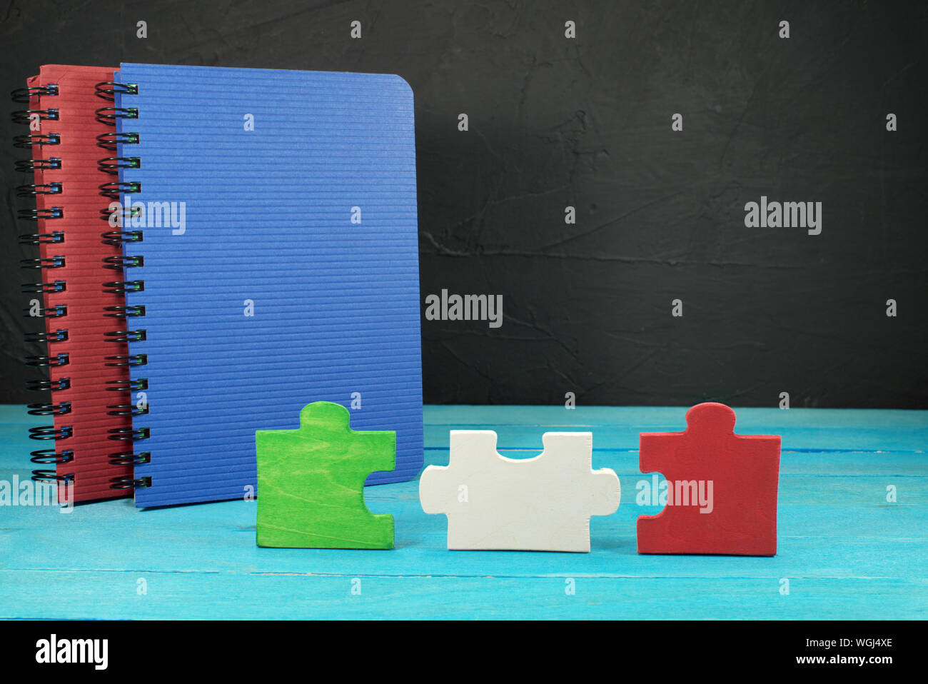 Problem solving and teamwork concept with colorful puzzle pieces in red ...