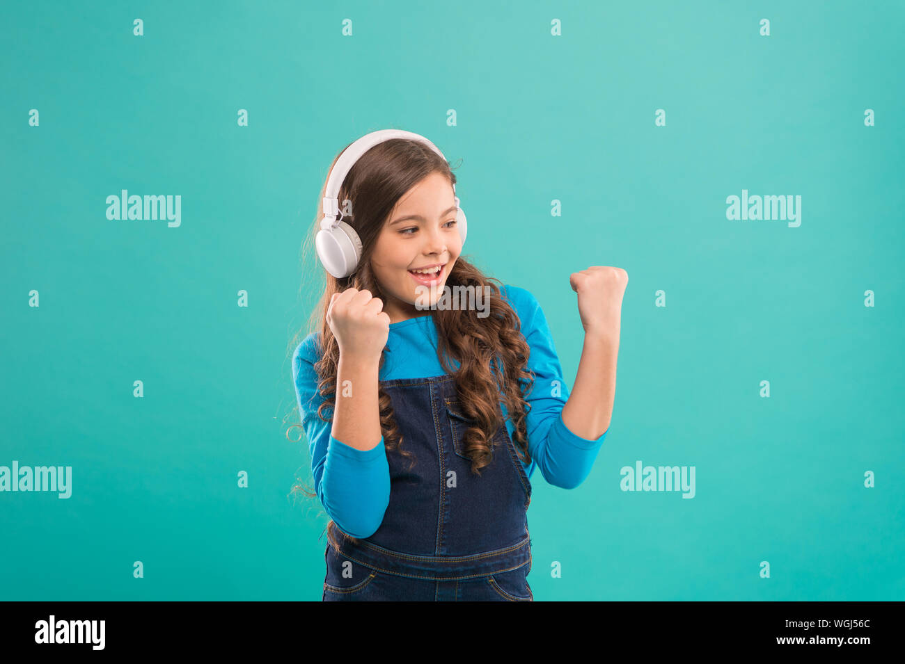 She isnt nothing but a winner. Happy little child making winner gesture ...