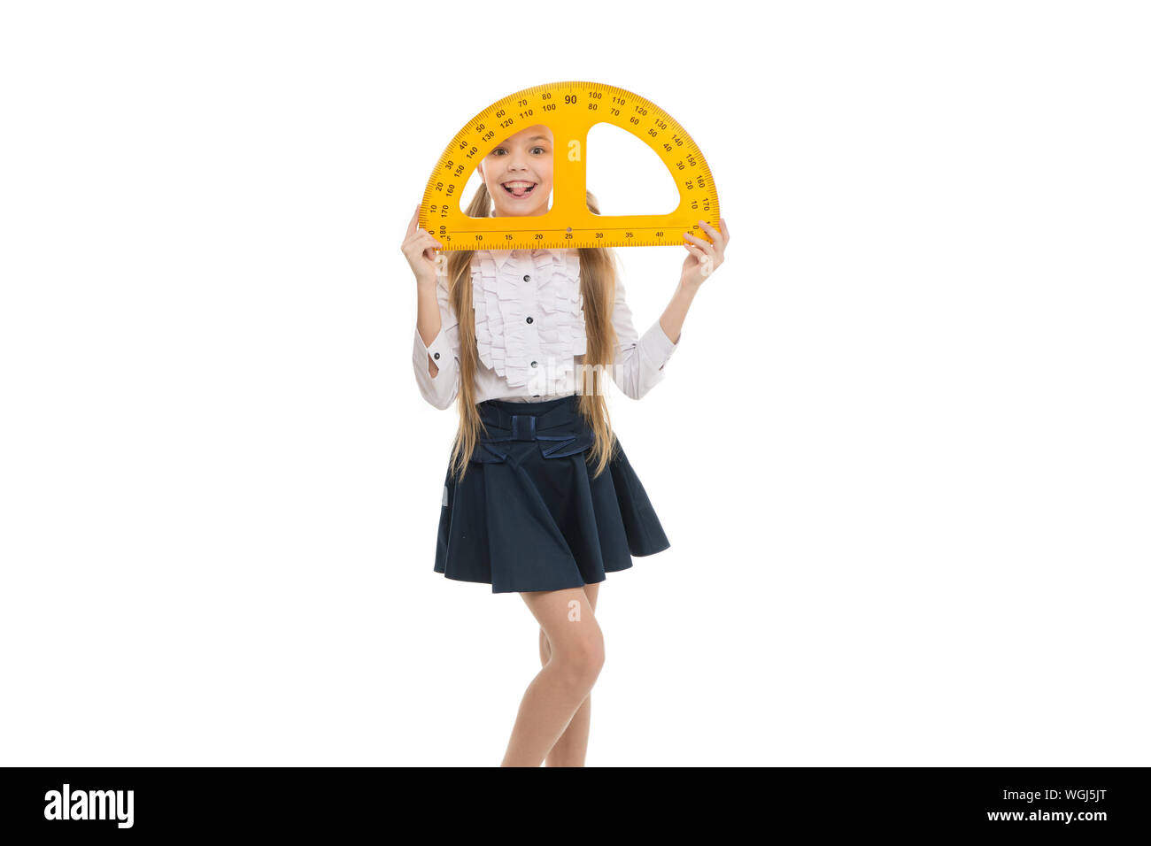 Little girl hold protractor and ruler for lesson. Small child with ...