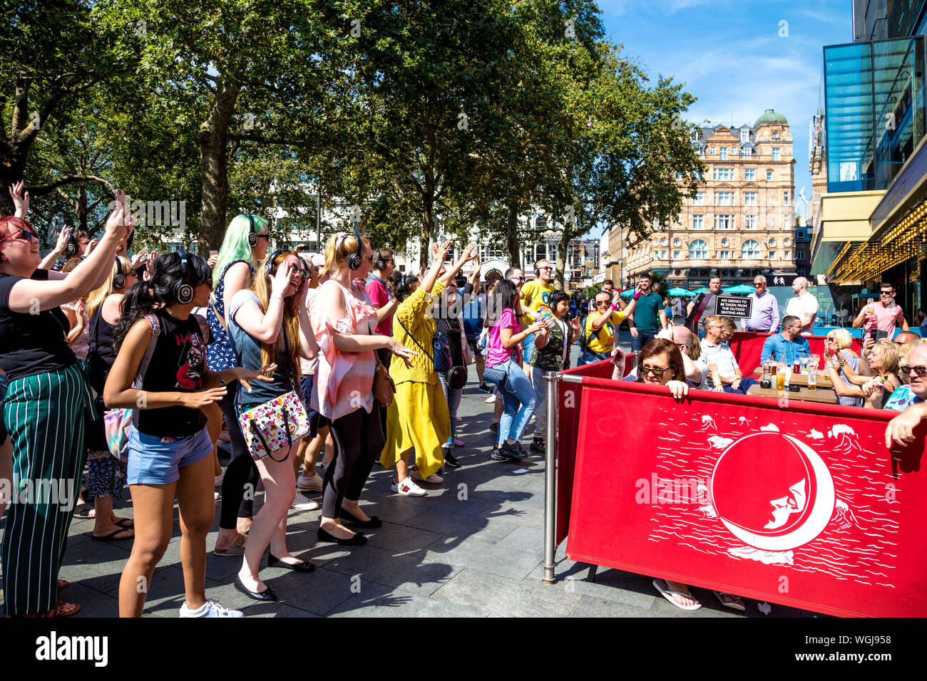 Group of people dancing, participating in a Silent Disco Tour in London ...
