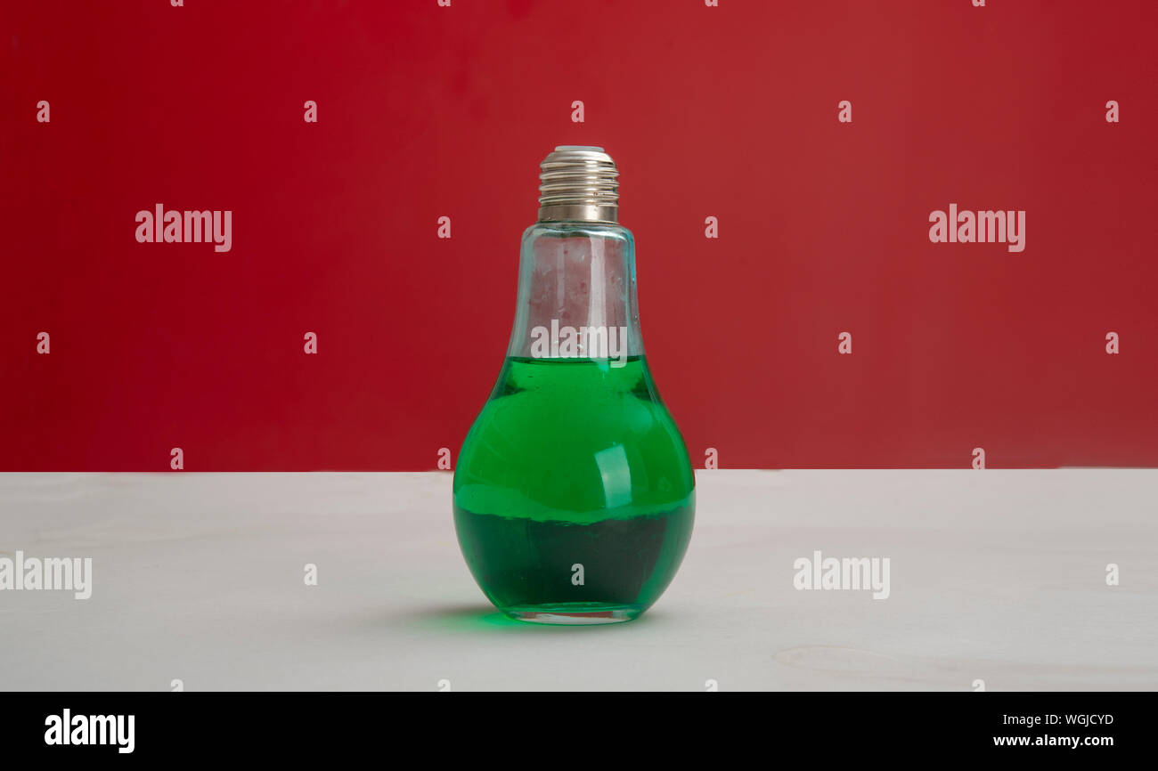 Light bulb with green water inside, Creative idea concept Stock Photo ...