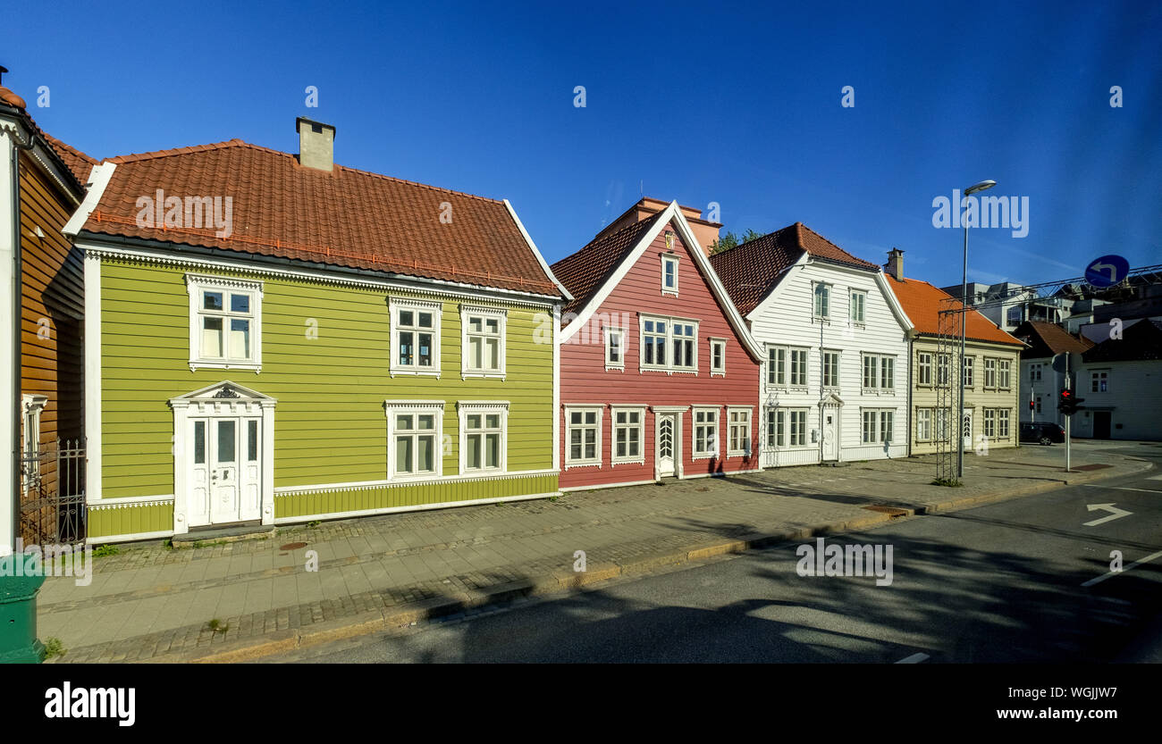 colorful row of wooden houses in town Bergen, street with traffic ...