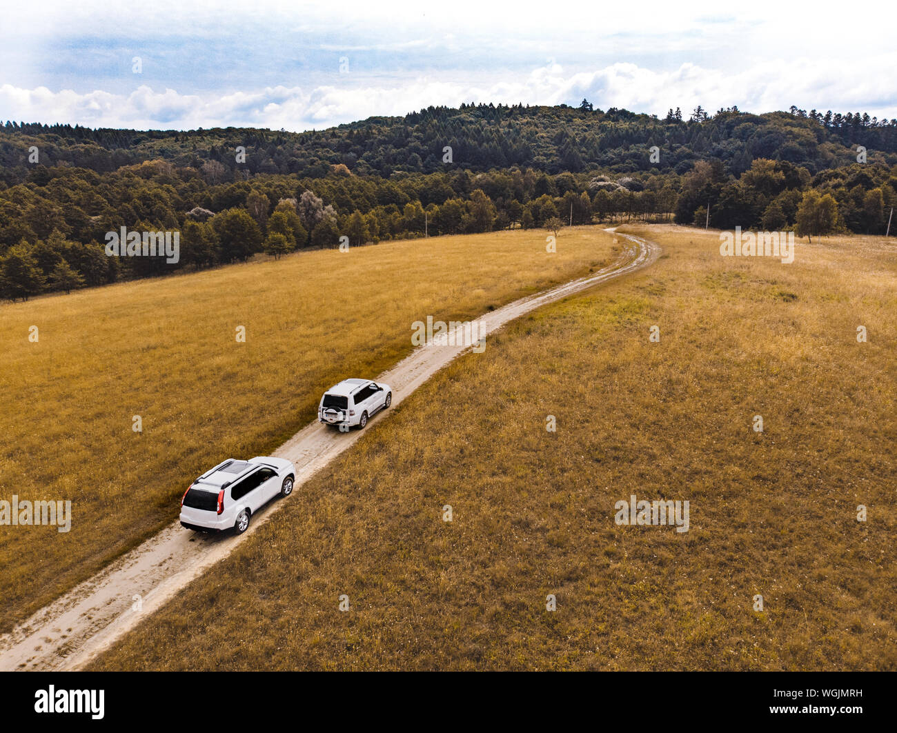 travel concept. two suv car riding by trail road. adventure time Stock ...