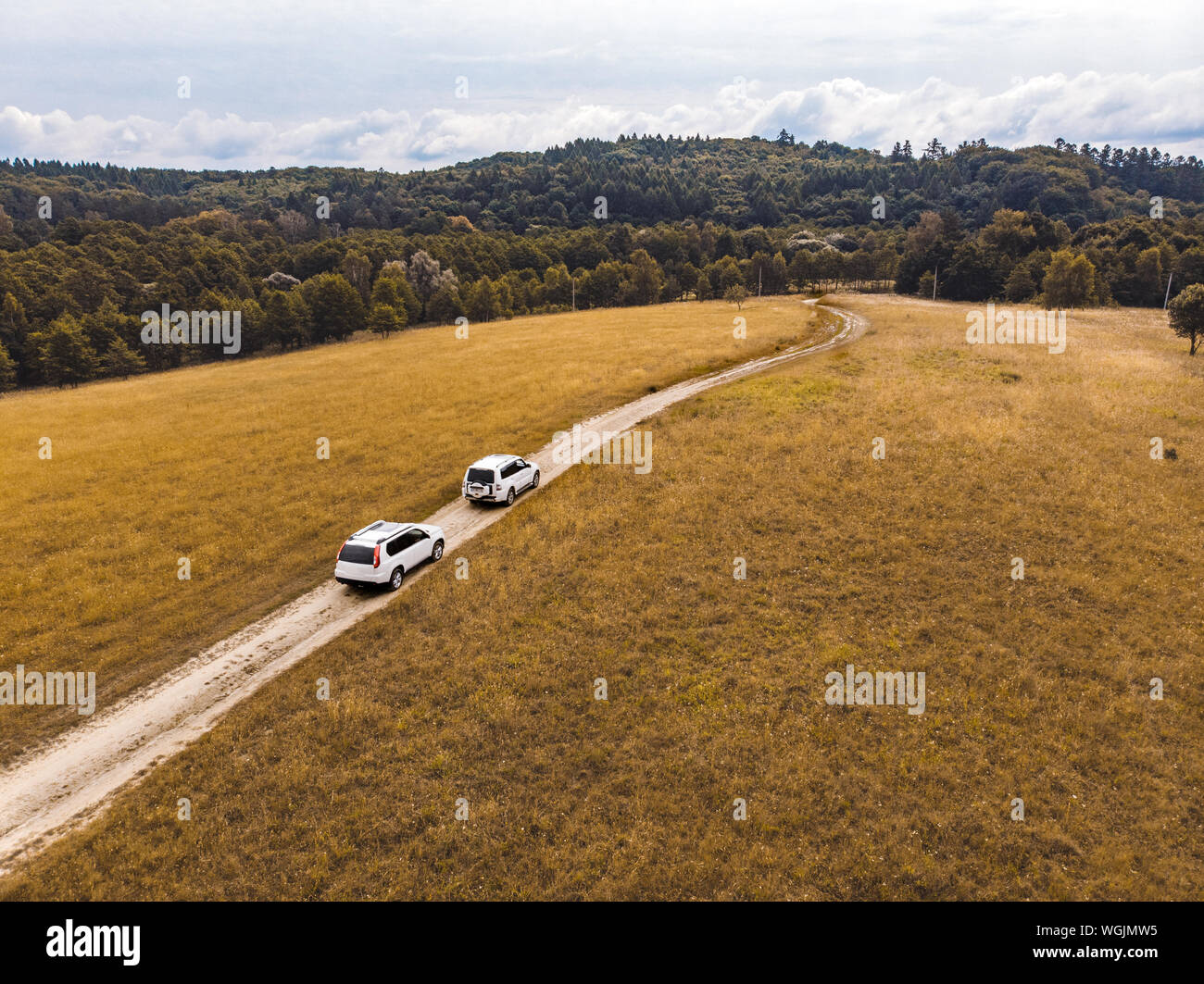 travel concept. two suv car riding by trail road. adventure time Stock ...