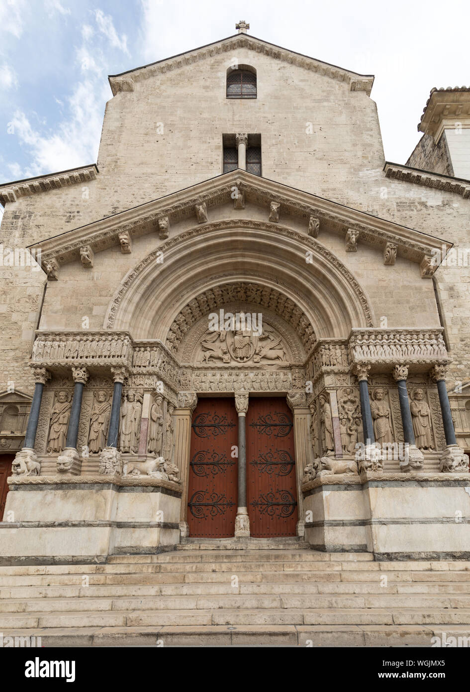 West facade of the Saint Trophime Cathedral in Arles, France. Bouches ...