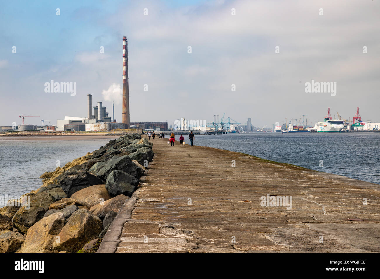 Poolbeg lighthouse path and Power plant in Dublin port, Dublin, Ireland ...