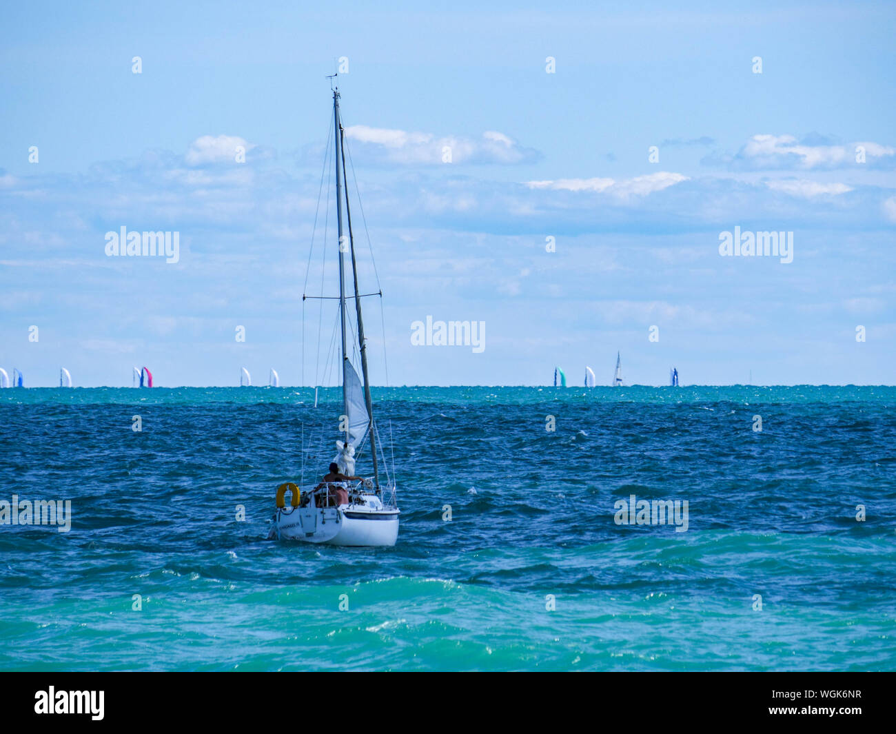 A sailboat navigating the choppy waters of Lake Michigan off Chicago ...