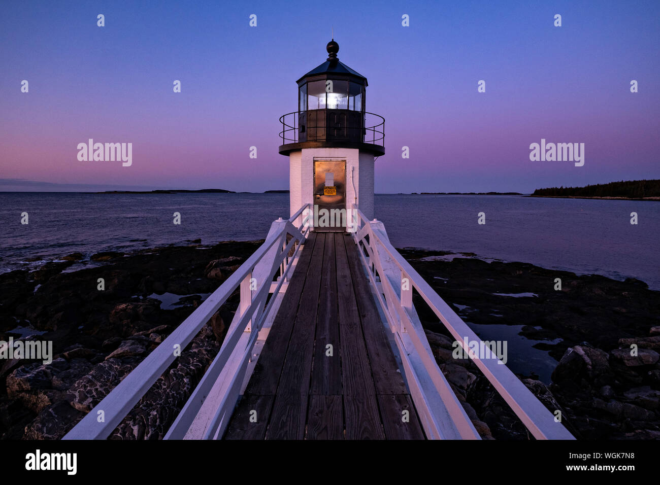Dawn breaks over the Marshall Point Lighthouse near Port Clyde, Maine ...