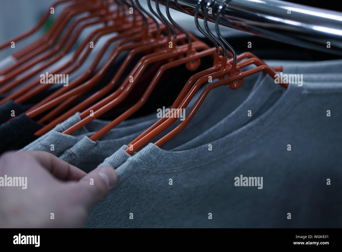 Hand holding clothes hi-res stock photography and images - Alamy