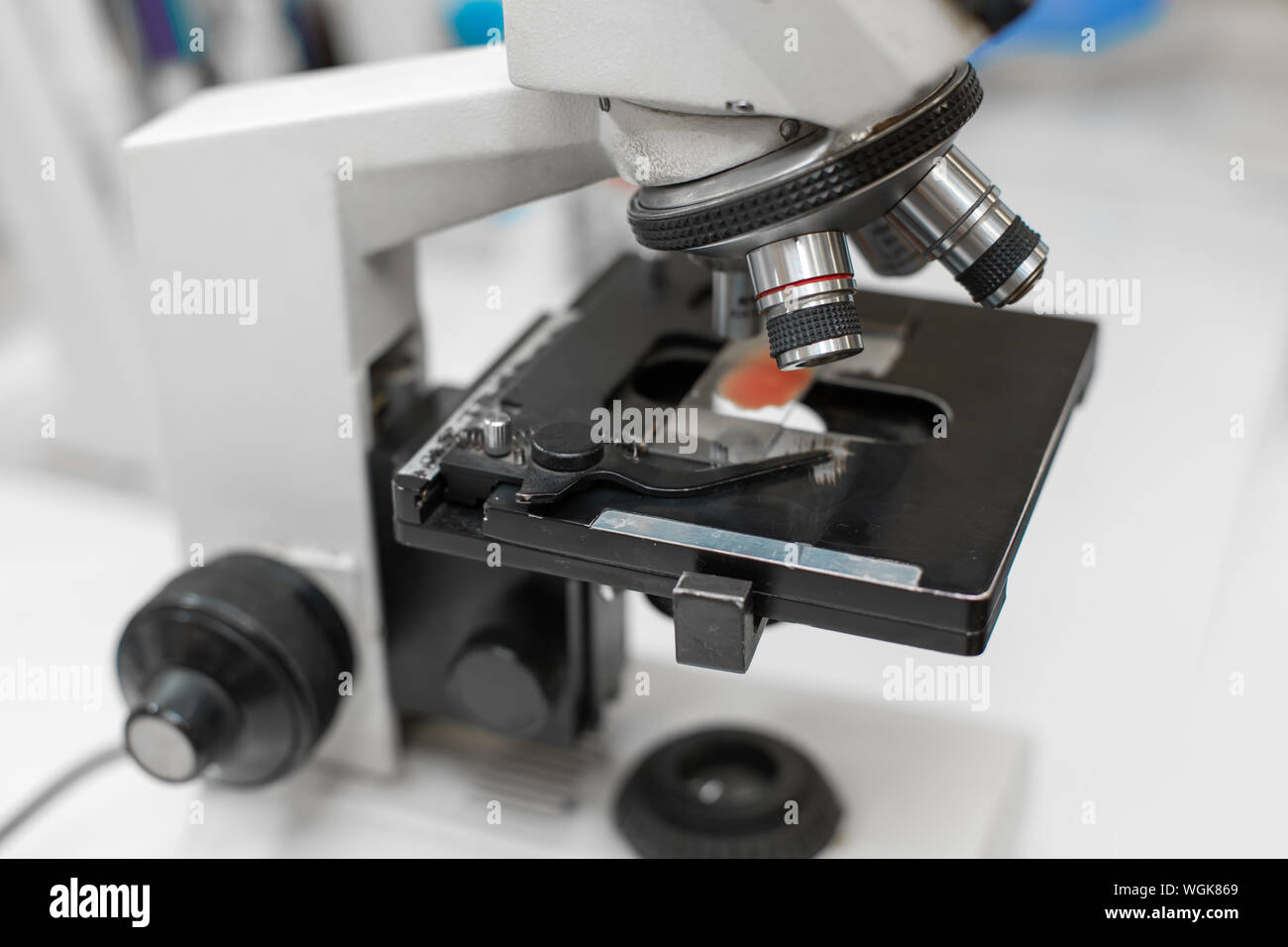 Closeup blood sample on glass in microscope Stock Photo - Alamy