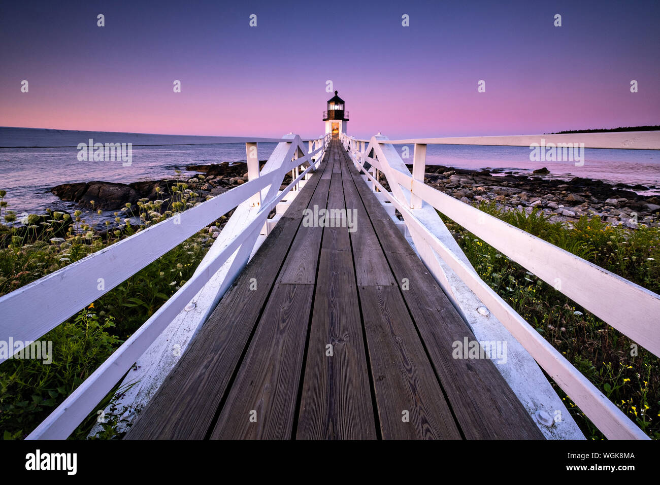 Dawn breaks over the Marshall Point Lighthouse near Port Clyde, Maine ...