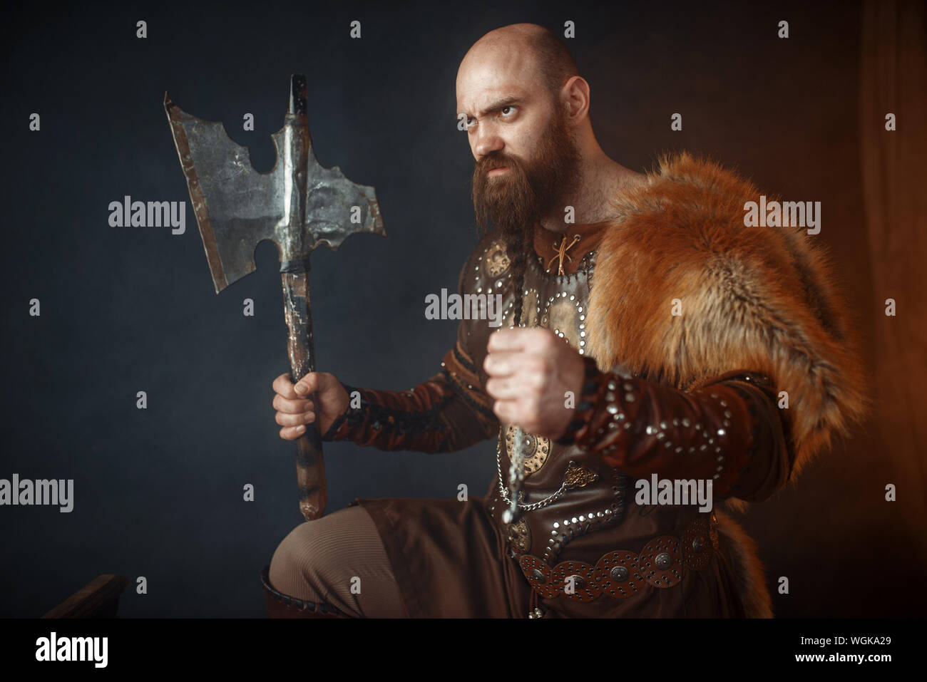 Viking with axe, barbarian, side view Stock Photo - Alamy