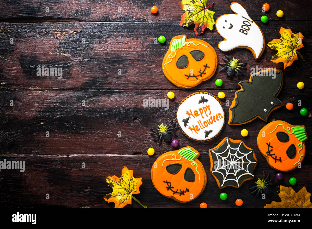 Halloween Gingerbread Cookies - pumpkin, ghosts, bat, on woden table ...