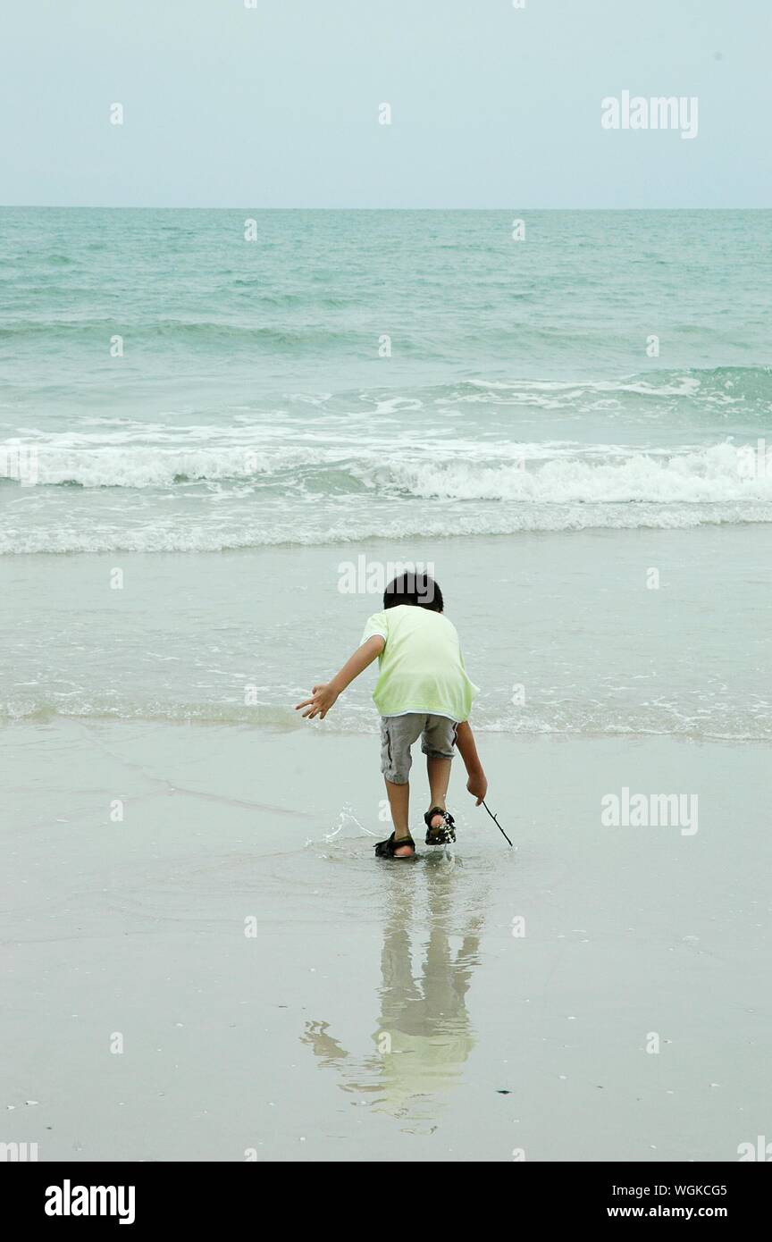 Boy bending over rear hi-res stock photography and images - Alamy