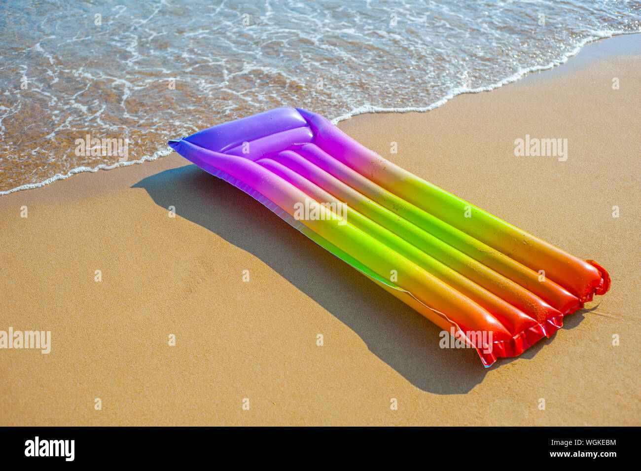Colorful inflatable mattress In The Sea Stock Photo - Alamy