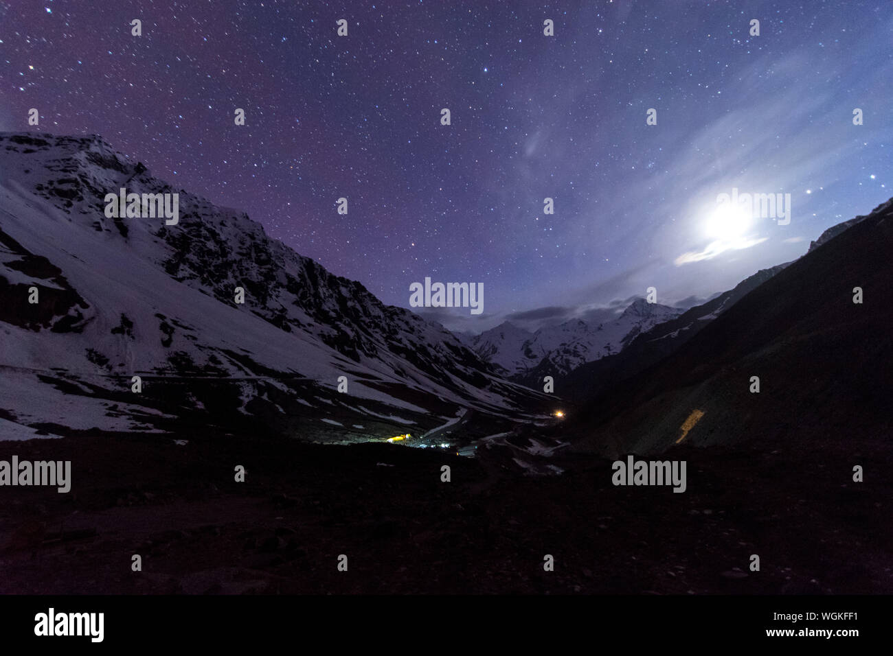 Full moon and white clouds on black night sky in himalayas Stock Photo ...