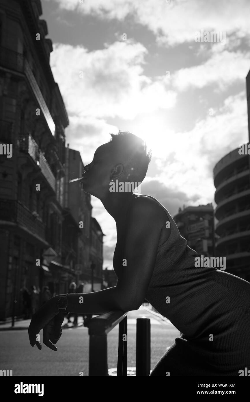 Woman smoking side view Black and White Stock Photos & Images - Alamy
