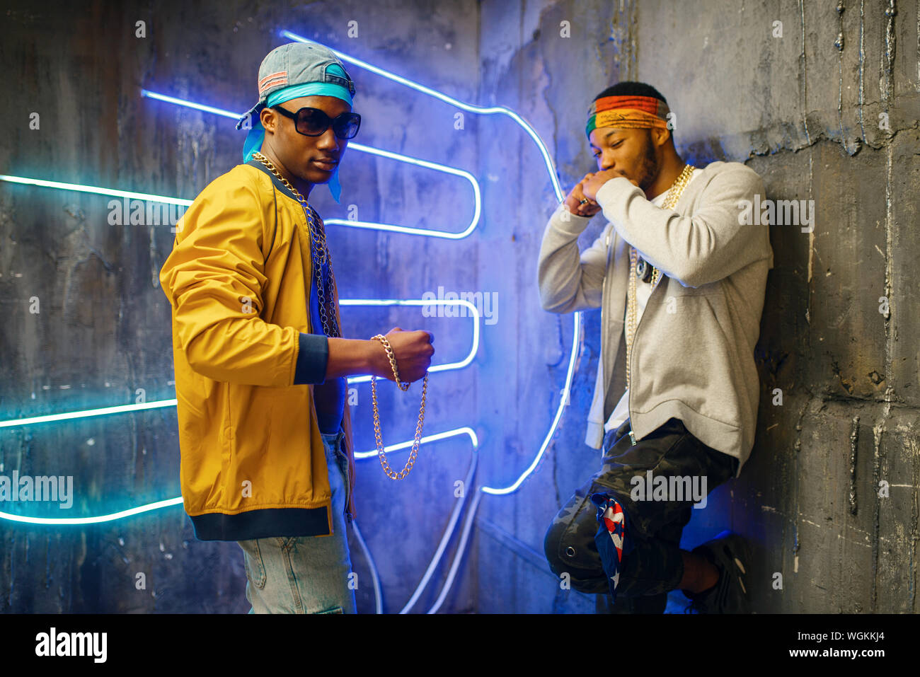 Two black rappers, neon lights on background Stock Photo - Alamy