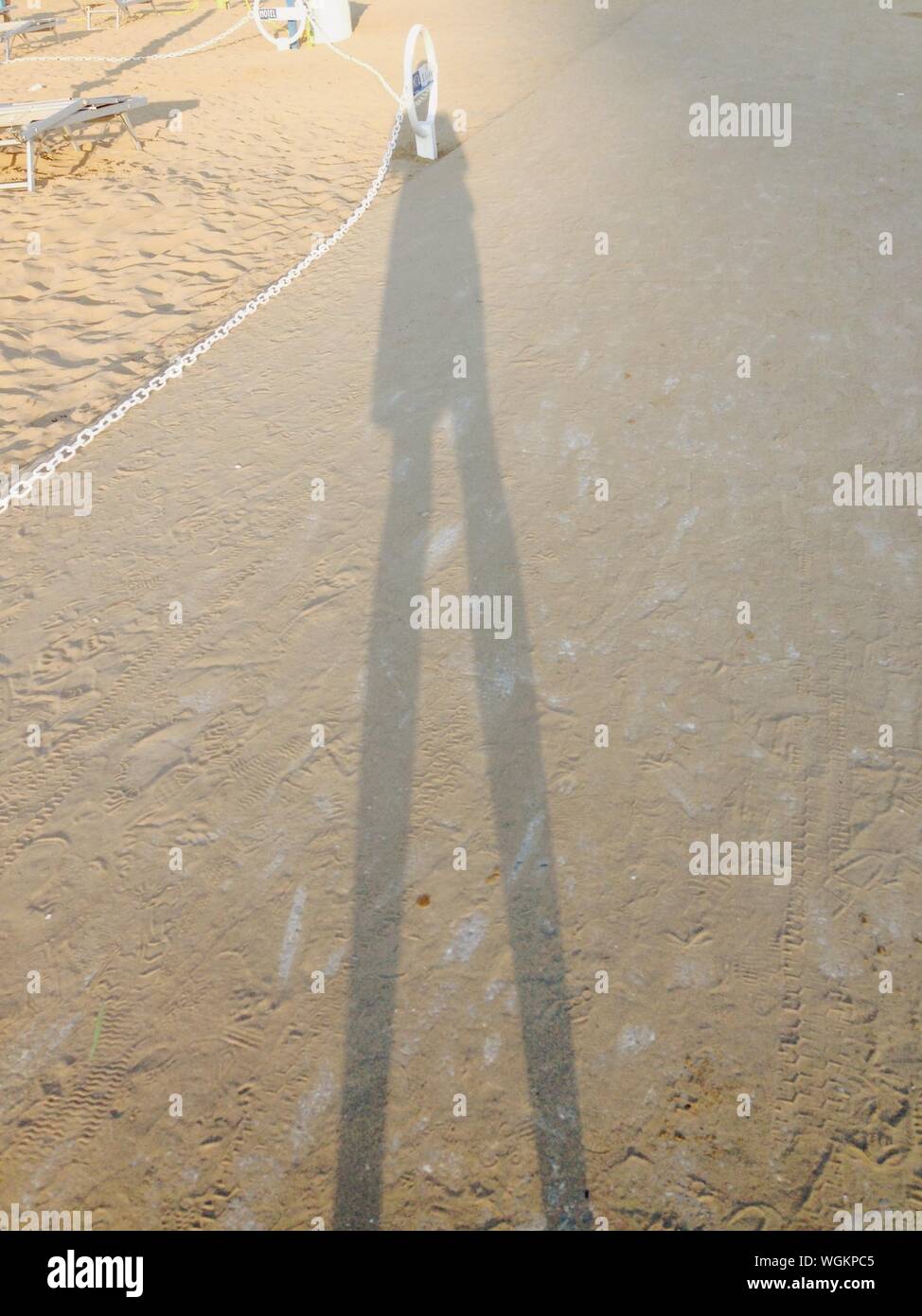 Human shadow on beach hi-res stock photography and images - Alamy