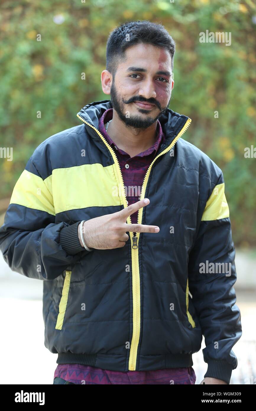 Man holding peace sign hi-res stock photography and images - Alamy