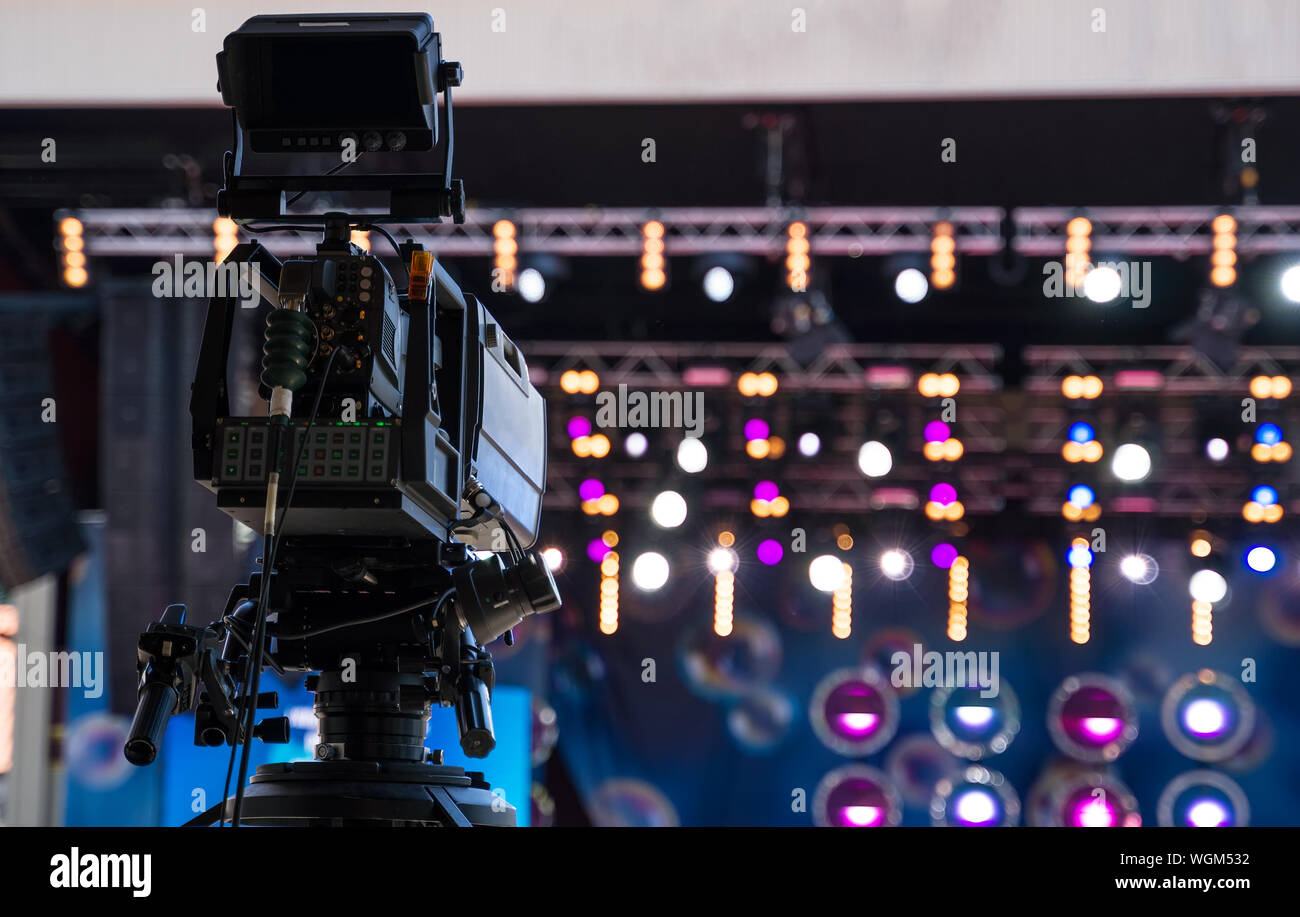 Professional video camera is ready to shoot the concert Stock Photo - Alamy