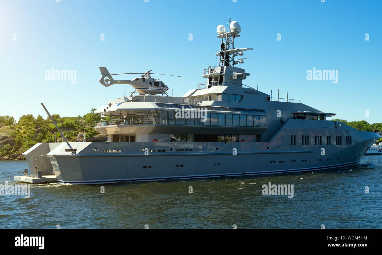 Private luxury ship with helipad in the coastal waters Stock Photo - Alamy